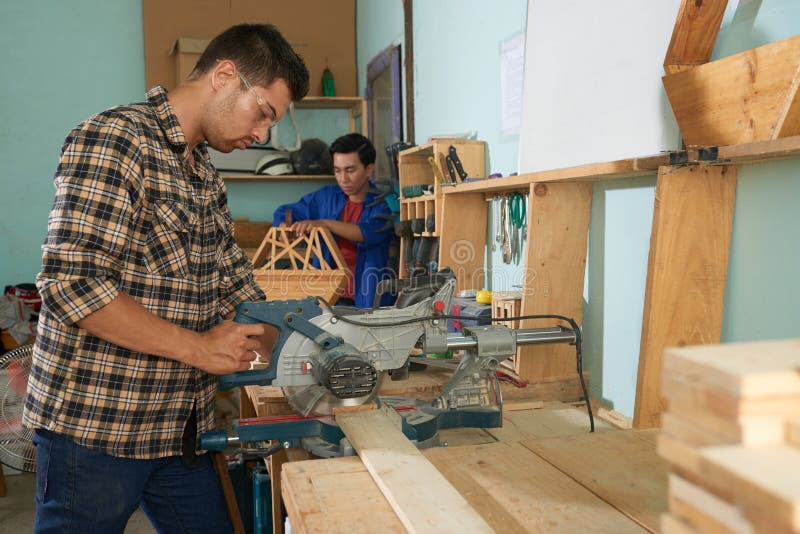 Sawing wood stock photo. Image of professional, joiner - 104472888