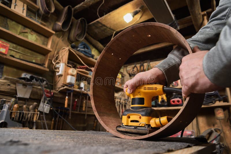 Carpenter Grinding Wooden Drum Shell from Inside with Sandpaper Stock ...