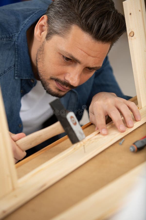 Carpenter with Hammer Hitting Nails Stock Photo - Image of custom ...