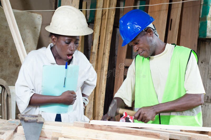 The Carpenter and His Apprentice Stock Photo - Image of boss, abidjan ...