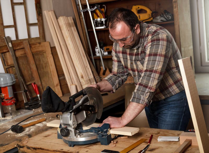 Carpenter in his workshop. stock image. Image of adult - 57324187