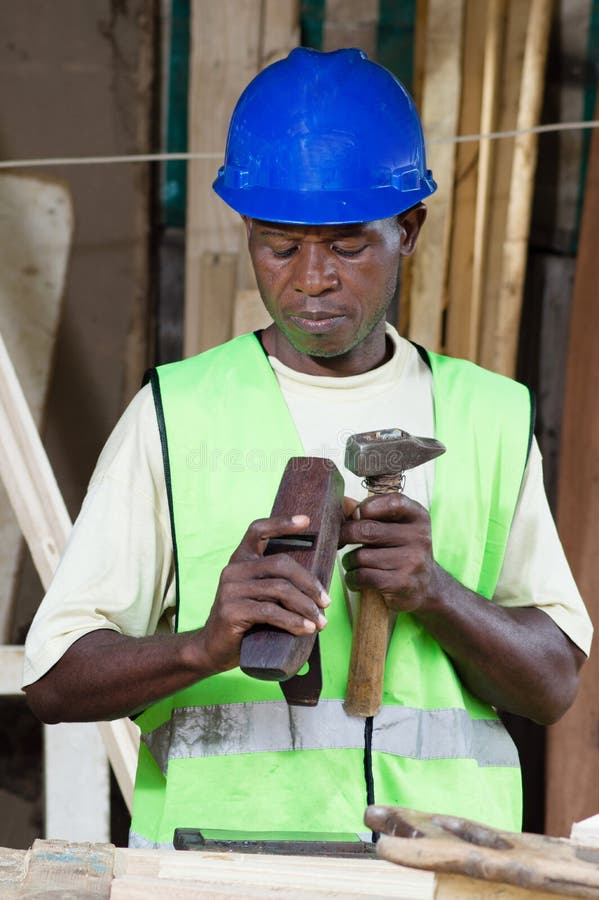 Carpenter and his tools. stock image. Image of table - 61775789
