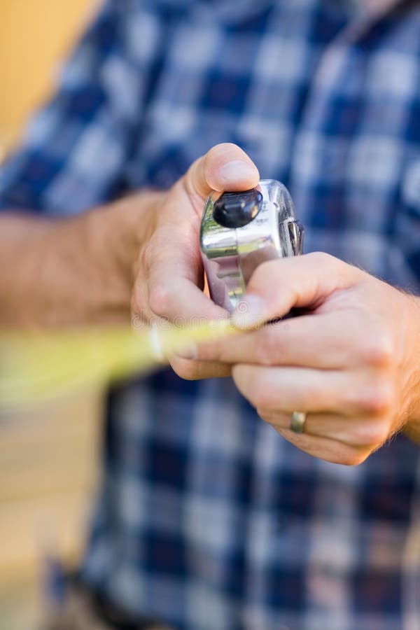 Carpenter Holding Tape Measure Stock Image - Image of occupation ...