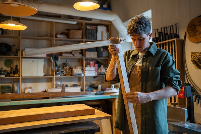 Craftsman Inspects Table Legs and Base, Ensuring Even Surfaces and ...