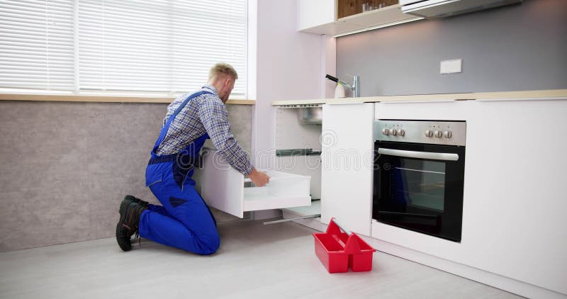 Carpenter Installing and Assembling Kitchen Furniture Stock Image ...