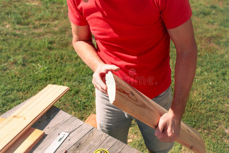Carpenter Installing Decking Boards. Carpenter Building Wooden Deck ...