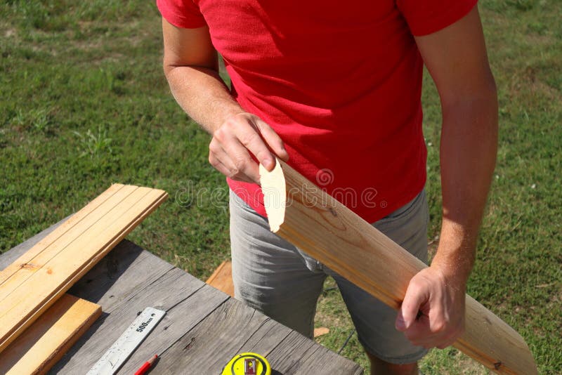 Carpenter Installing Decking Boards. Carpenter Building Wooden Deck ...
