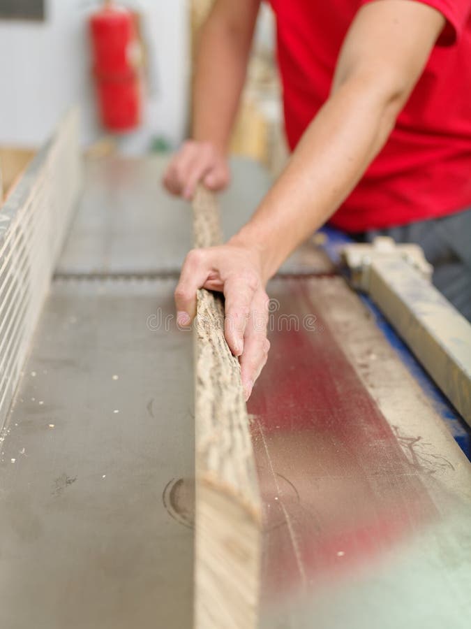 A Male Carpenter Working on a Metal Carpenter`s Tool with a Sharp Round ...