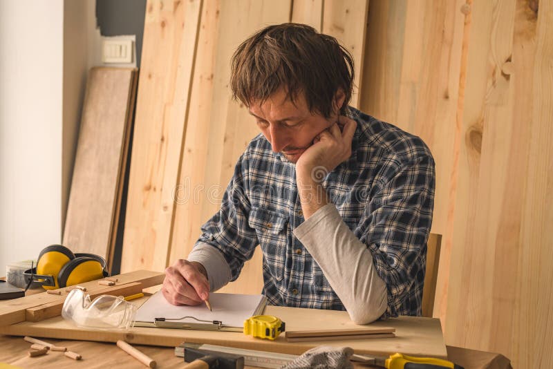 Carpenter Making Woodwork Project Notes on Clipboard Paper Stock Image ...