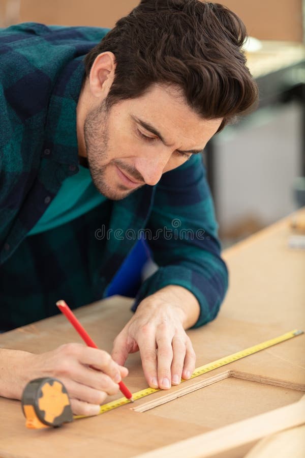 Carpenter Marking Measurements on Piece Wooden Board Stock Image ...