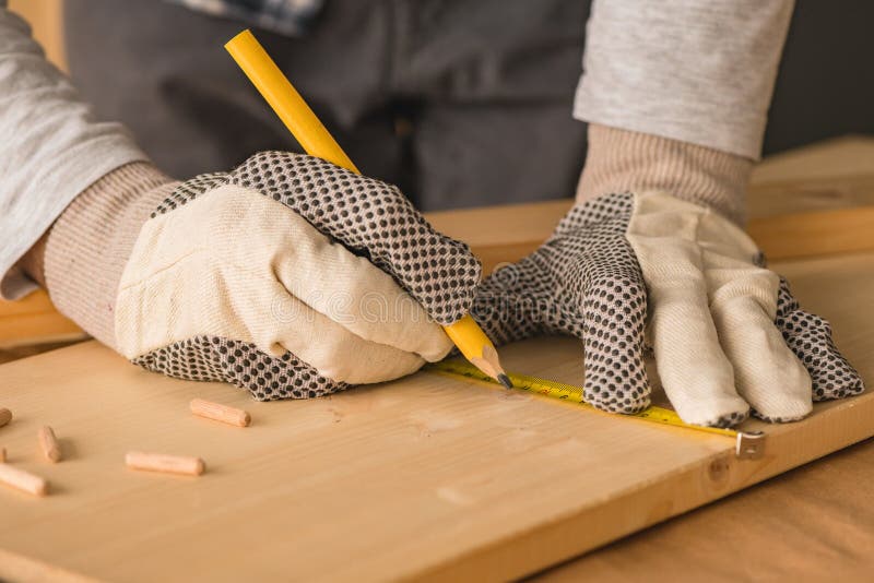 Carpenter Marking Pine Wood Plank for Cutting Stock Photo - Image of ...