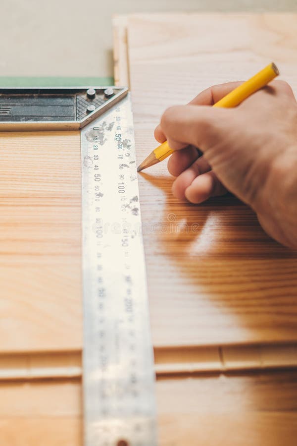 Carpenter Marks the Smooth Cutting Line on the Board with the Help of a ...