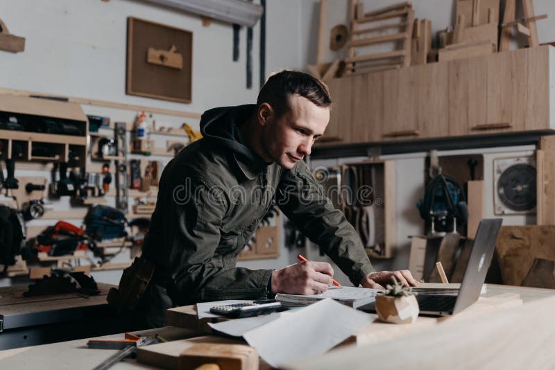 Carpenter Master is Phoning with the Smartphone in His Carpentry ...
