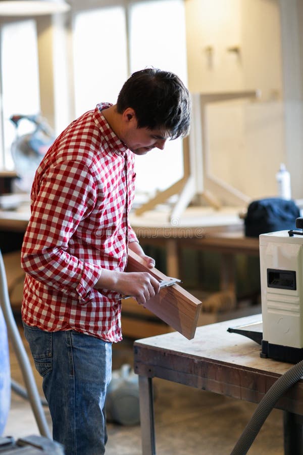 Carpenter Measures the Board Thickness of the Callipers, Joiner Stock ...