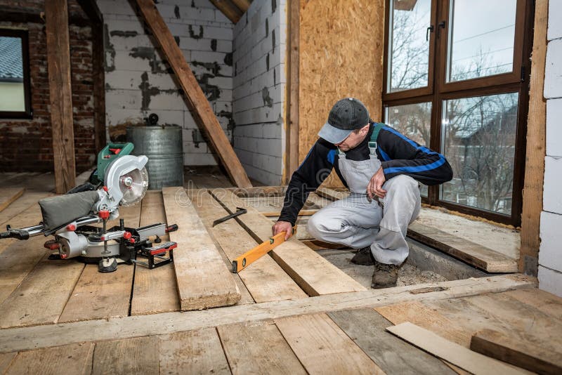 The Carpenter Measures the Floor Level Stock Image - Image of mitre ...