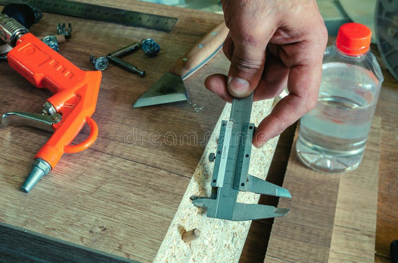 Carpenter Measures the Holes Made with a Caliper Stock Photo - Image of ...