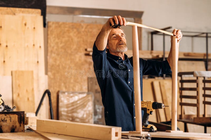 Carpenter Measures the Width between the Legs Stock Image - Image of ...