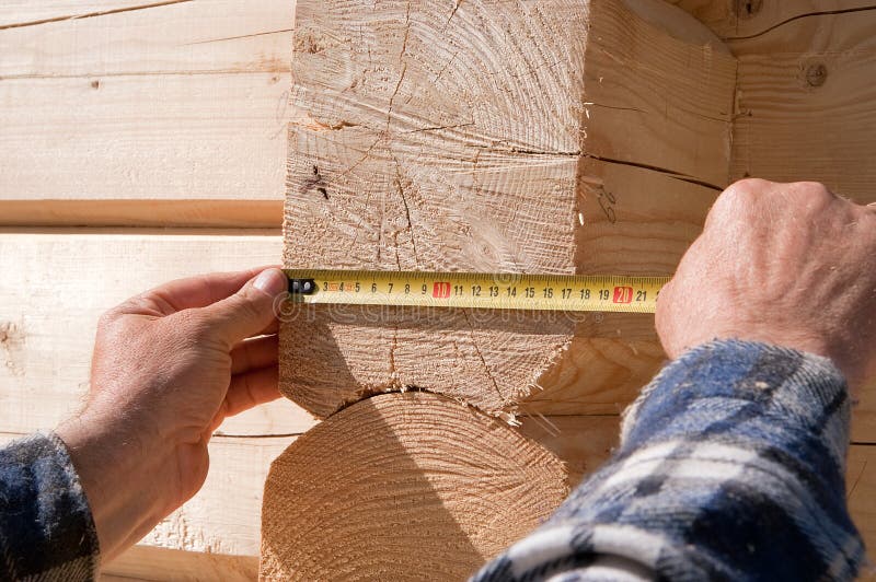 Carpenter Measures Wooden Logs Stock Image - Image of carpentry ...
