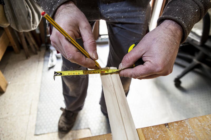Carpenter Measuring Wood And Marking With Pencil Stock Photo - Image of ...