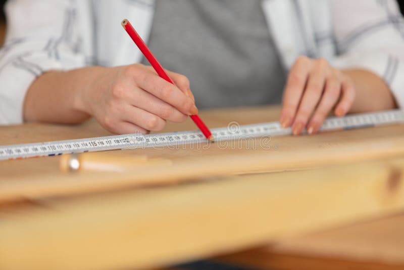 Carpenter Measuring Wood at Tablesaw in Workshop Stock Photo - Image of ...