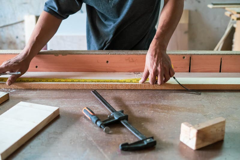 Carpenter Measuring the Wood at the Workshop Stock Photo - Image of ...