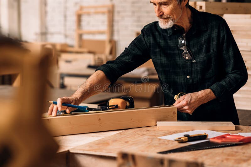 Carpenter Measuring Wooden Plank with Tape Measure Stock Photo - Image ...