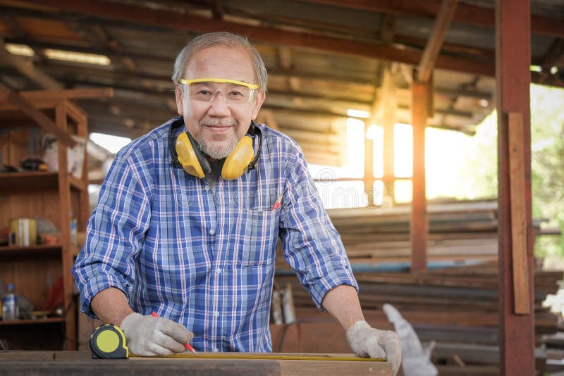 Carpenter Men Work on the Measurements of Wood in Carpentry Shop Stock ...