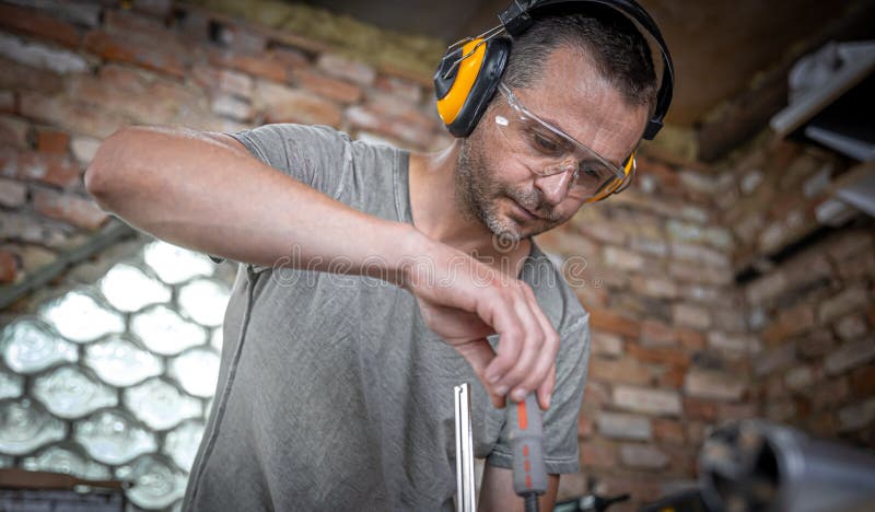 A Carpenter Works with Professional Woodworking Tools Stock Photo ...