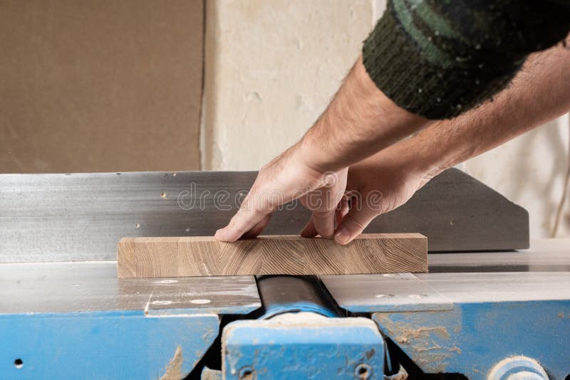 A Carpenter Processes an Ash Element on a Electric Jointer Stock Image ...