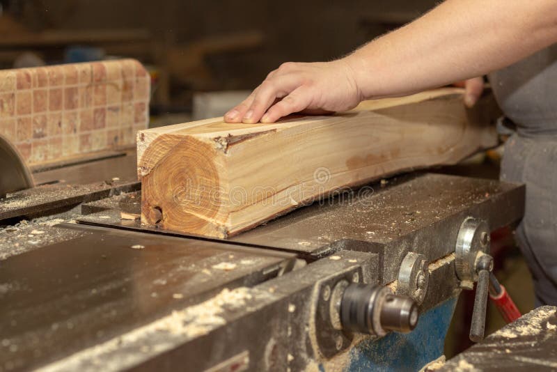 A Carpenter Processes Wood on a Machine Stock Photo - Image of ...
