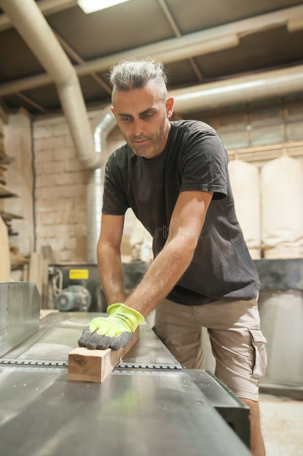 Carpenter Processes Wood in a Furniture Workshop Stock Image - Image of ...