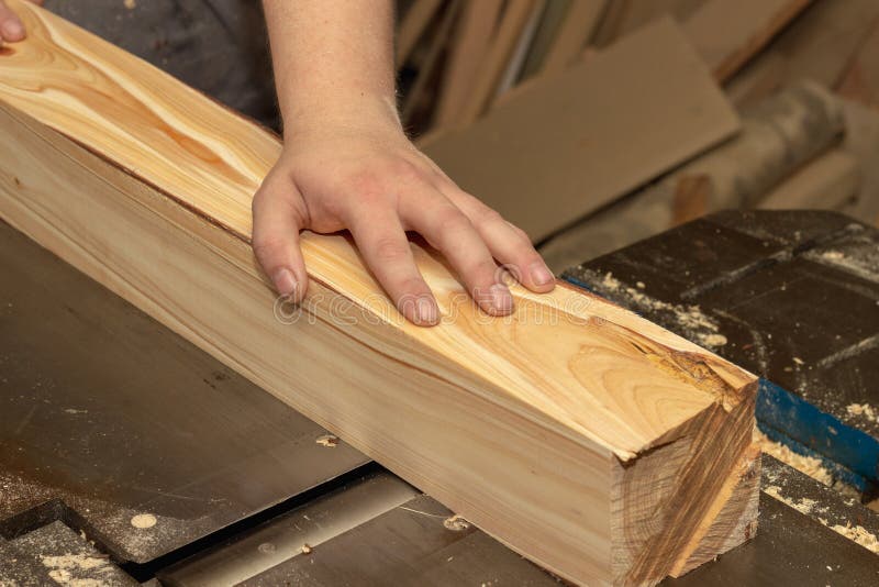 A Carpenter Processes Wood on an Electric Machine Stock Photo - Image ...
