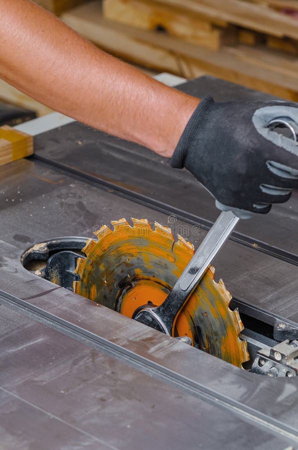 Carpenter Replaces Circular Saw in Machine Tool. Replacing Saw in ...