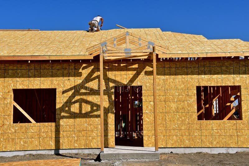 Carpenter on Rooftop of Building Under Construction Stock Photo - Image ...