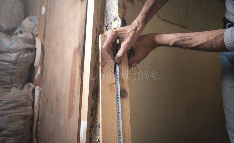 Carpenter with Ruler Measuring Wood Plank Stock Photo - Image of repair ...
