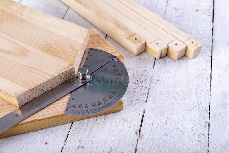 A Carpenter& X27;s Protractor Placed on a Piece of Wood. Measurement of ...