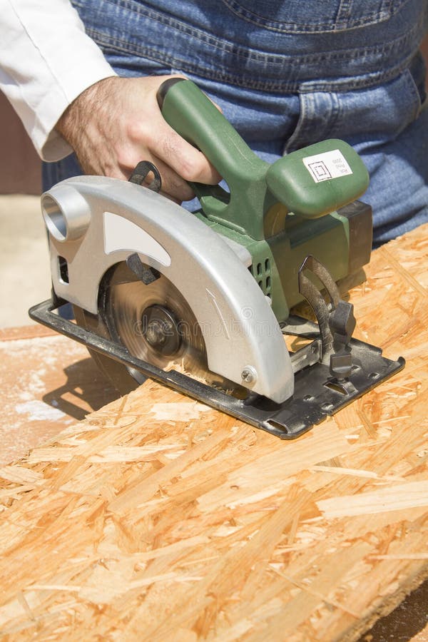 Carpenter`s Workshop. Carpenter Cuts the OSB Stock Photo - Image of ...