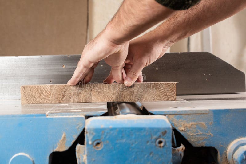 A Carpenter Shapes Ash Bars Manually on a Machine Stock Photo - Image ...