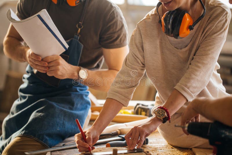 Carpenter Training Female Apprentice To Use Plane Stock Image - Image ...