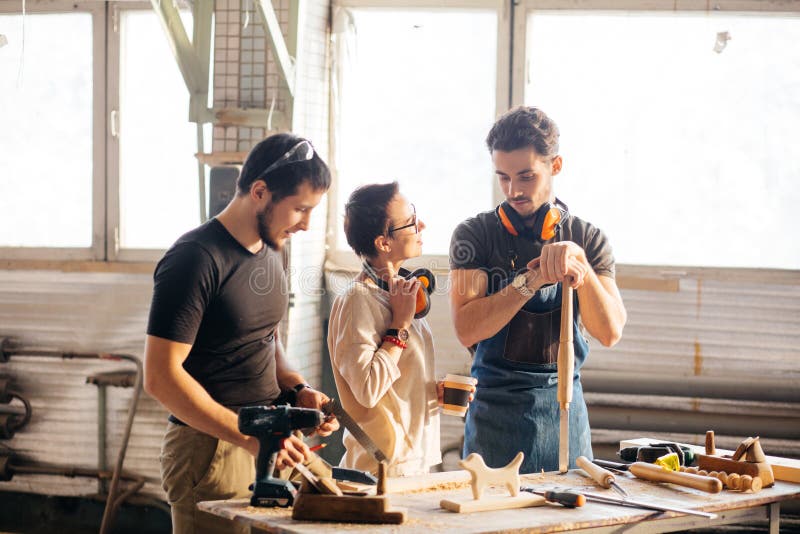 Carpenter Training Female Apprentice To Use Plane Stock Image - Image ...