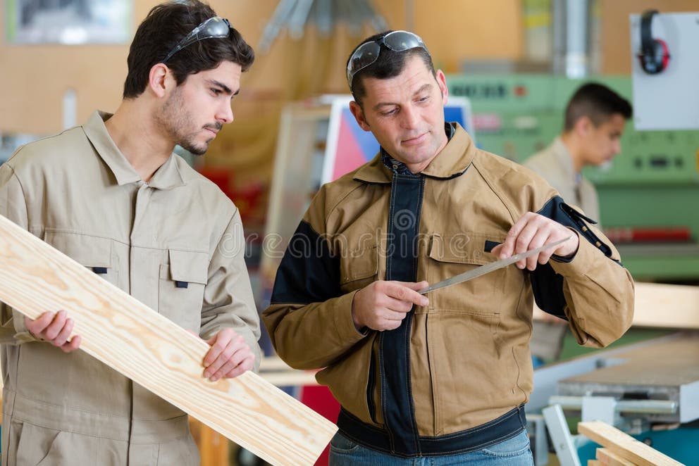 Carpenter Showing Tool To Apprentice Stock Image - Image of ...