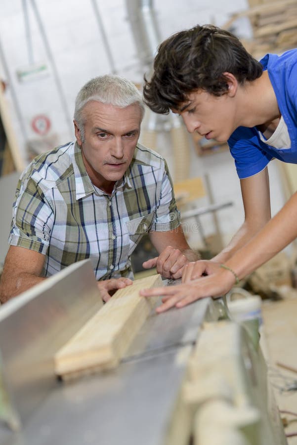 Carpenter and Son Using Table Saw Stock Image - Image of middle ...