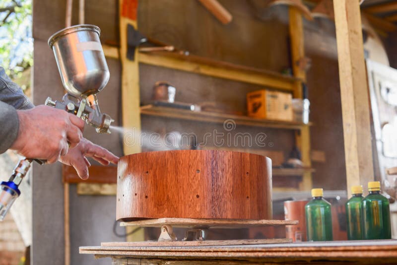 Carpenter Spraying Lacquer on Merbau Wood Drum Shell Stock Image ...