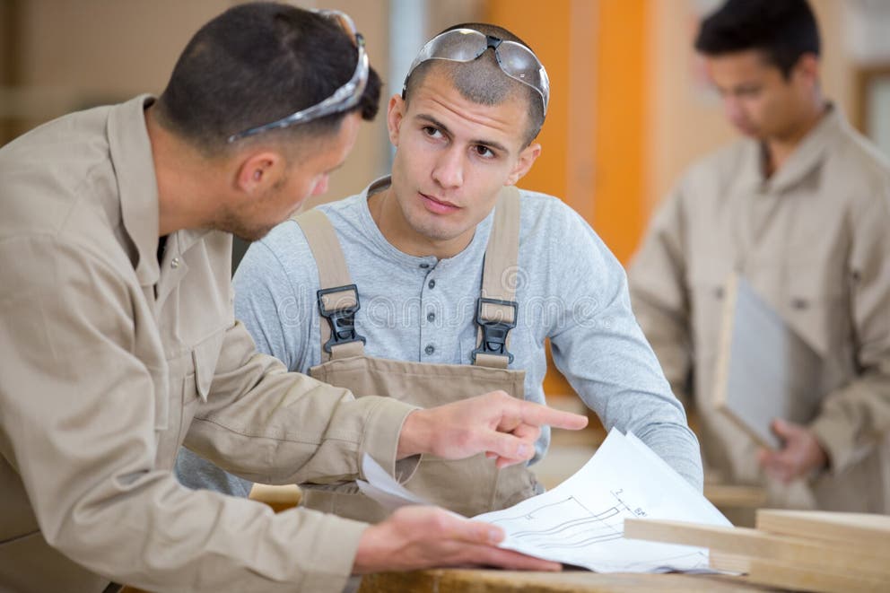 Carpenter with Student in Workshop Stock Photo - Image of professional ...