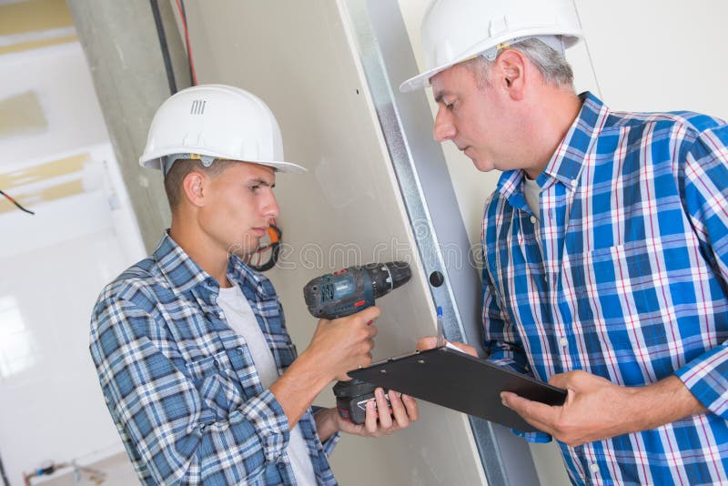 Carpenter with Student in Workshop Assembling Door Stock Image - Image ...