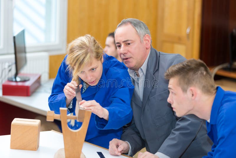 Carpenter with Students in Woodworking Workshop Stock Photo - Image of ...