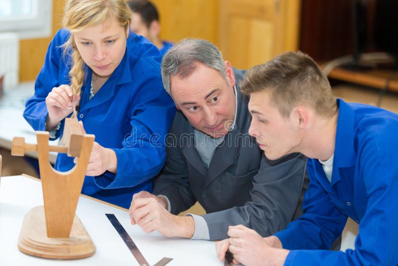 Carpenter with Students in Woodworking Workshop Stock Photo - Image of ...