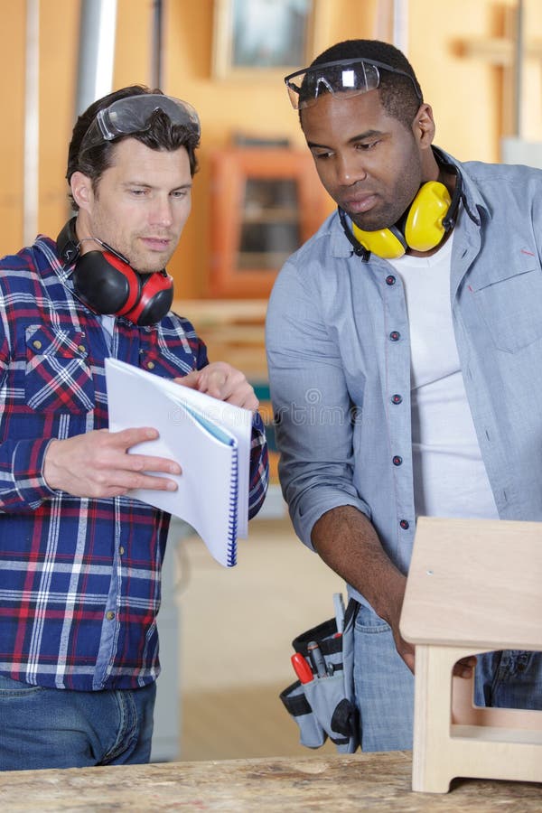 Carpenter Teaching Apprentice How To Build Bird House Stock Photo ...