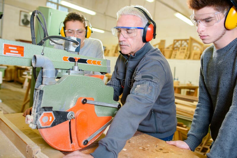 Carpenter Teaching Apprentices How To Use Circular Saw Stock Photo ...