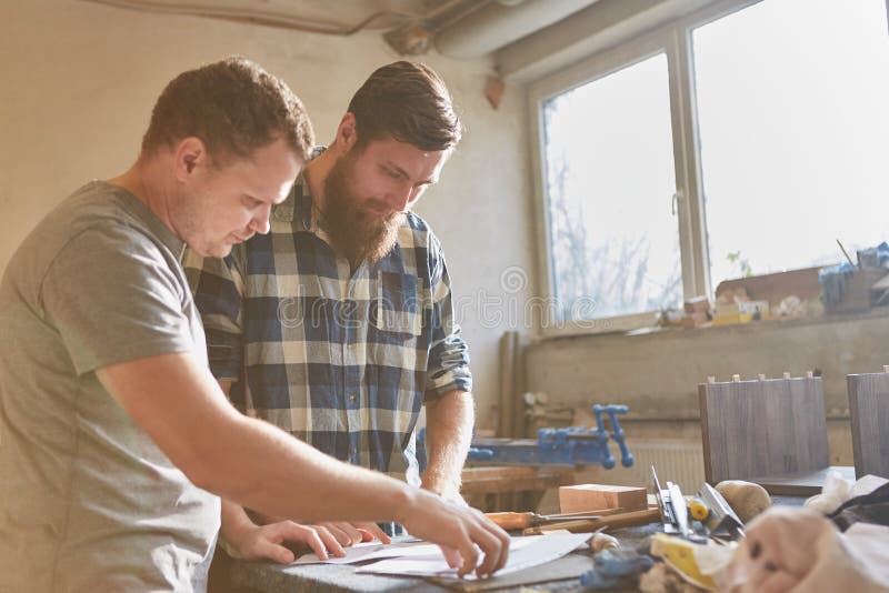 Carpenter Team Discusses a Carpentry Job Stock Image - Image of ...